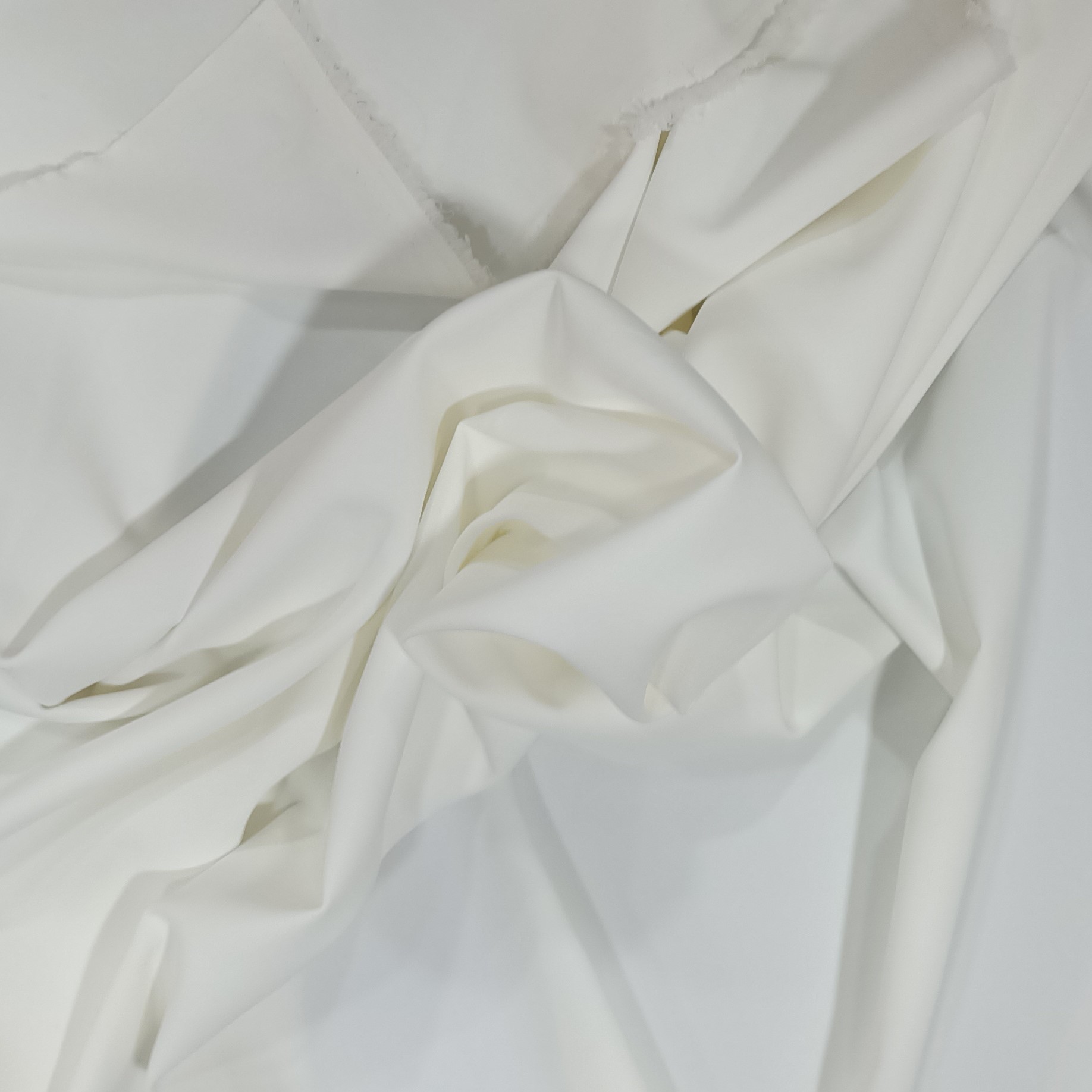 Tela bielástico color blanco roto - Tu tienda de Telas